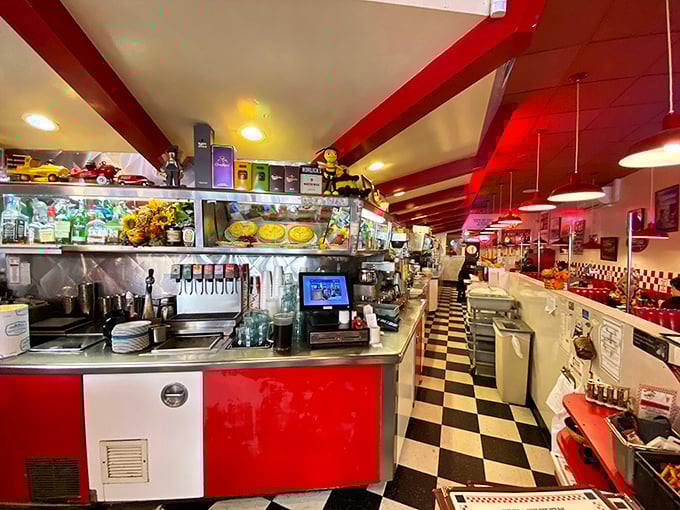The counter and soda fountain stand ready for service, a command center of culinary nostalgia where milkshakes are born and coffee cups never empty.