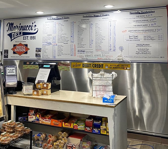Behind this counter, sandwich destiny awaits—where meats are sliced with the precision of a Swiss watchmaker.