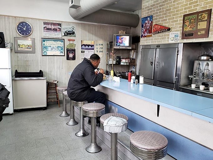A solitary diner enjoys the ritual of a Mike's meal—a moment of culinary meditation in a busy world. Some come for the ham, others for the peace.