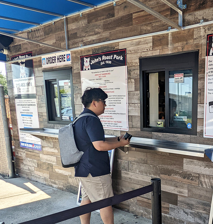 The anticipation is palpable as another customer prepares to join the ranks of the sandwich-enlightened. That backpack will be heavier with leftovers.