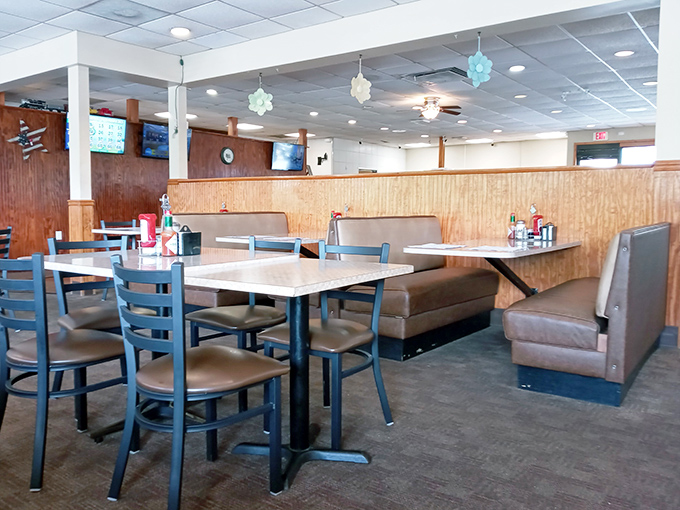 Booths designed for comfort, not Instagram aesthetics, invite you to settle in for a meal that prioritizes satisfaction over social media approval.