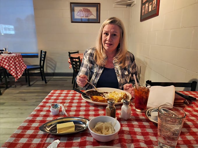 The look of pure contentment—when your plate holds the kind of steak that makes conversation unnecessary and joy inevitable.