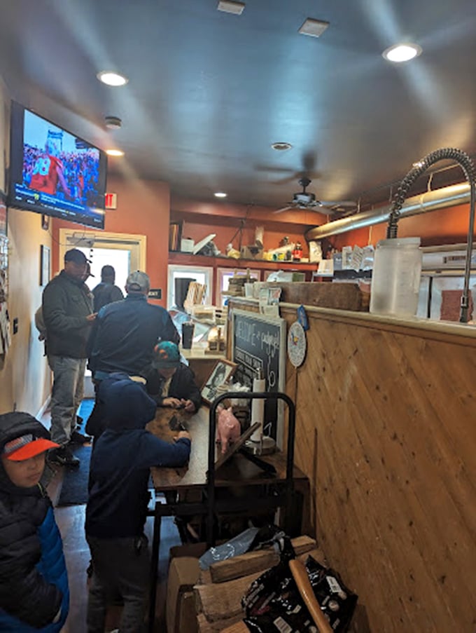 The interior of Pudgey's proves that great barbecue doesn't need fancy surroundings—just hungry people and a TV to ignore while eating.