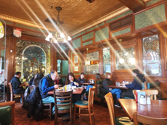 The dining room buzzes with the energy of satisfied customers – some who've been coming here since before smartphones replaced newspapers.