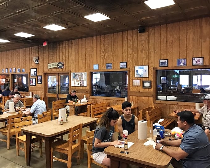 Families bonding over brisket—proof that the best conversations happen when everyone has something delicious in front of them and sauce on their fingers.