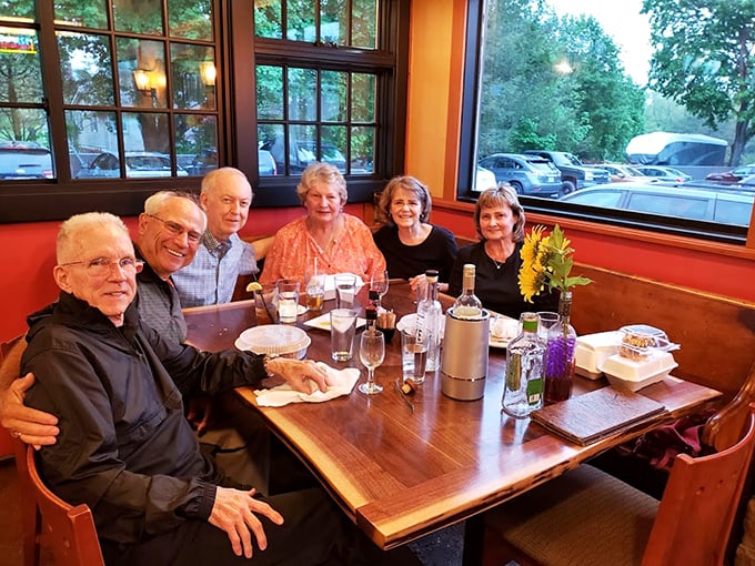 Happy diners gathered around the table – proof that great food creates the best memories.