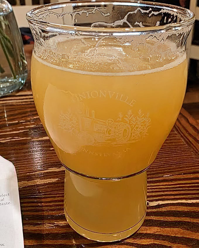 A golden elixir in a glass that catches the light like liquid sunshine. This isn't just a beverage—it's a pause button for life's hectic pace.