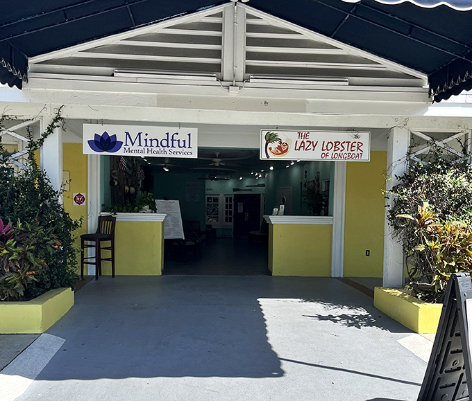 The entrance beckons with tropical plants and sunny yellow walls—Florida's version of "follow the yellow brick road" to seafood nirvana.
