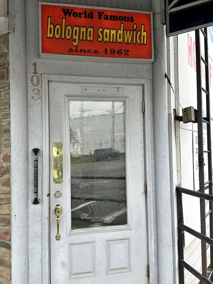 "World Famous bologna sandwich since 1962" – a door sign that makes more honest promises than most politicians ever will.