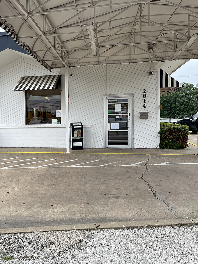 The entrance—humble, unassuming, and numbered—like the doorway to a secret club where the password is "hungry."