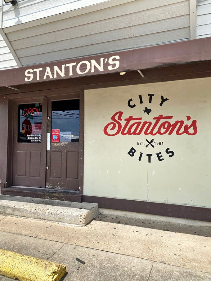 The entrance to Stanton's doesn't whisper—it announces itself with confidence. That "OPEN" sign might be the best news you'll get all day.