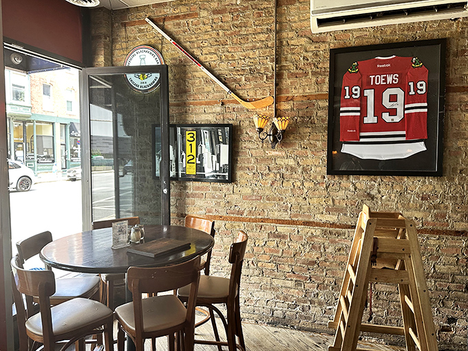 Where sports memorabilia meets exposed brick—a quintessentially Chicago corner where hockey jerseys watch over pizza consumption with approval.