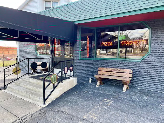 The entrance that's welcomed generations of diners. That neon "PIZZA SPAGHETTI" sign is like a bat signal for the hungry.