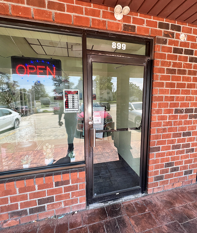 That glowing red "OPEN" sign might as well say "Enter here for happiness" – a humble doorway to a world of Japanese culinary delights.