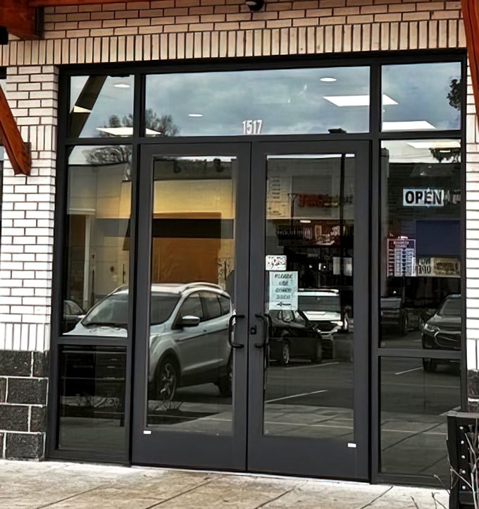 The entrance to flavor town isn't flashy—just clean glass doors with the address clearly marked. No pretense, just good eating ahead.
