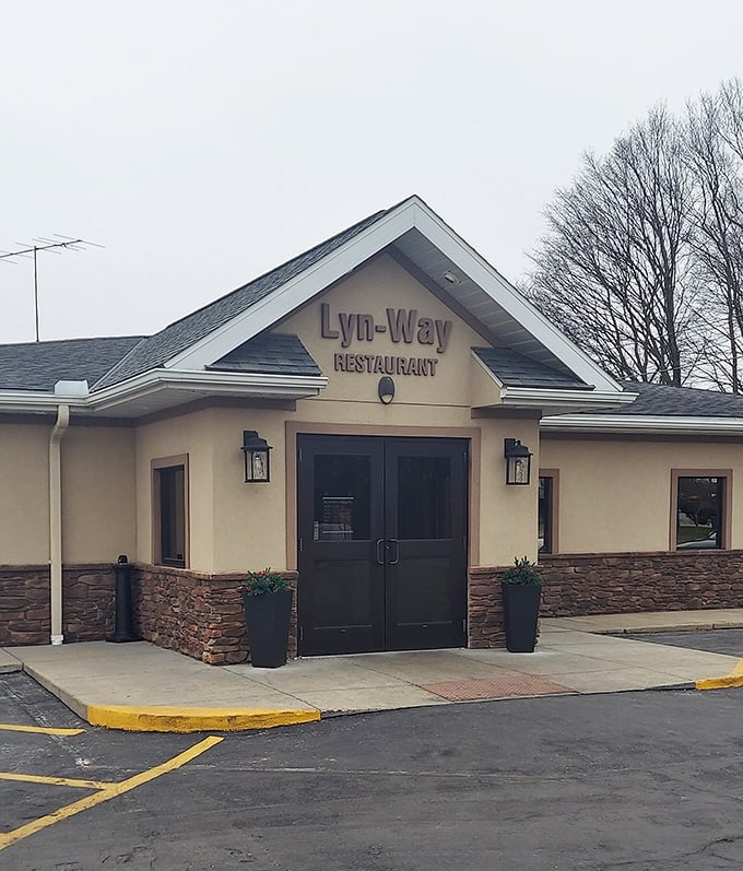 The entrance on a cloudy day still promises sunshine for your taste buds. Those stone accents aren't just decorative—they're as solid as the restaurant's reputation.