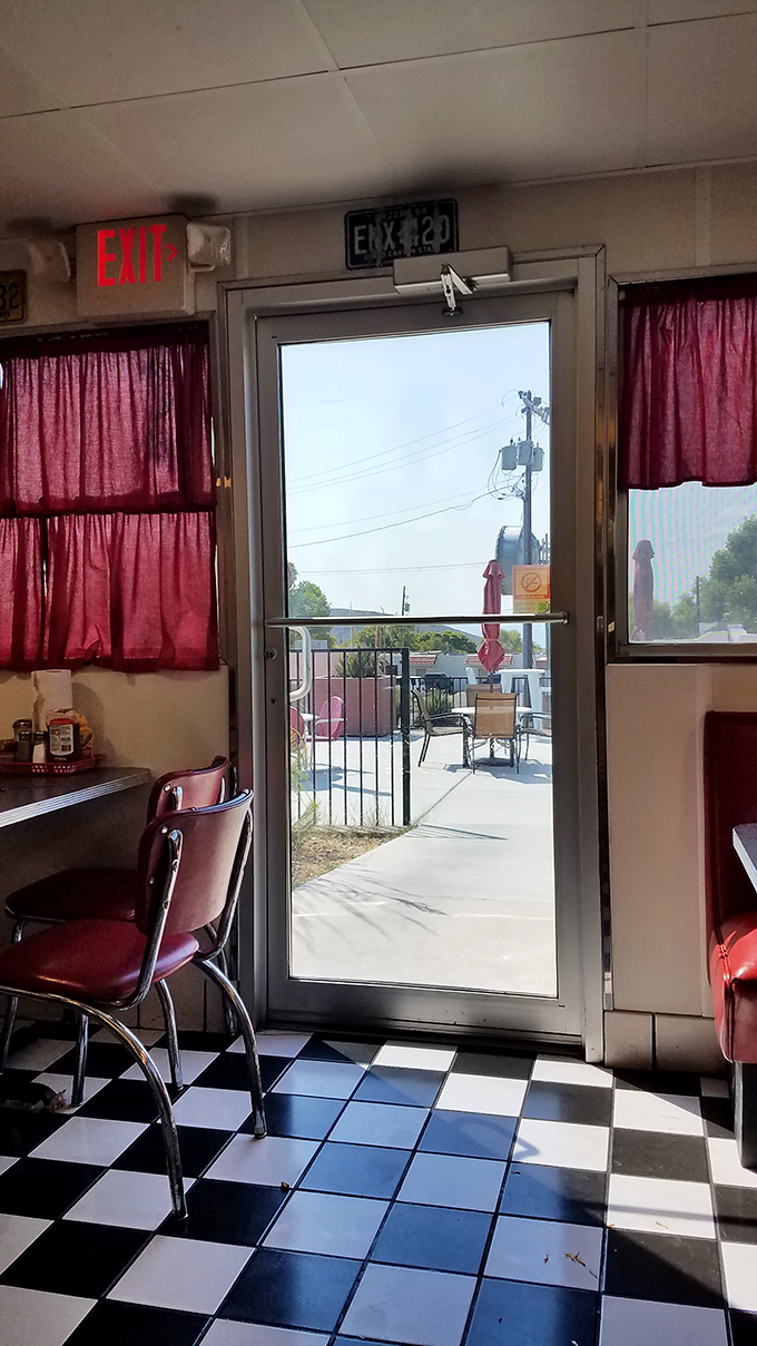 Even the exit view promises you'll be back—red curtains framing the doorway like the final act of a delicious performance.