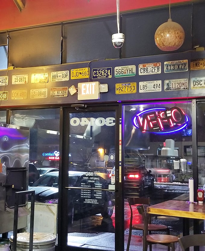 License plates line the walls like badges of honor from barbecue travelers. This place has fans who've crossed state lines for those ribs.