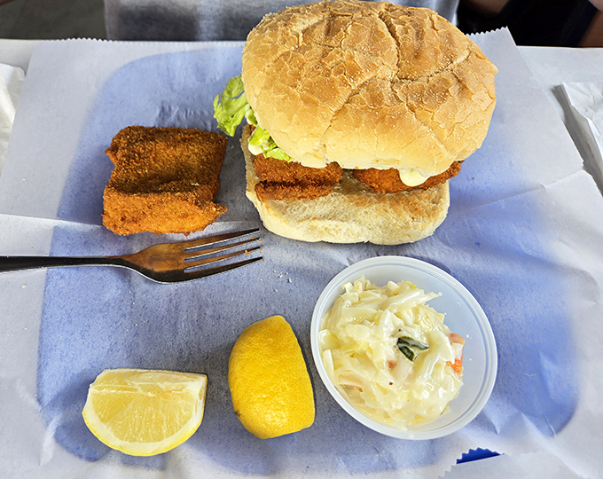 A fish sandwich that means business—crispy fillet, fresh roll, and all the fixings. Proof that sometimes the best seafood comes between bread.