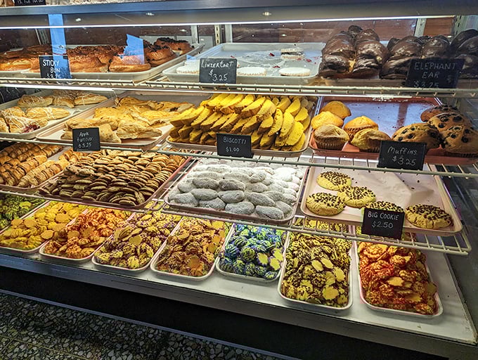 The dessert case—where willpower goes to die. Each tray is a different chapter in the story of "I'll just have one bite."