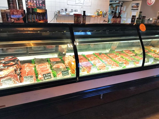 Behind glass lies the butcher's pride – cuts of meat displayed like the treasures they are, promising greatness on your plate.