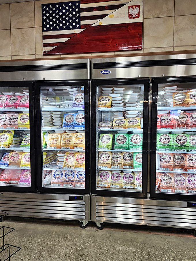 Behind glass doors, a United Nations of pierogi varieties await. The Polish-American flag above perfectly symbolizes this delicious cultural bridge in refrigerated form.