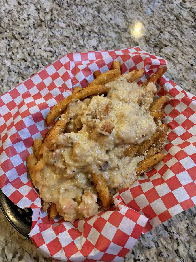 Loaded fries that don't just cross the line between appetizer and main course—they erase it completely with cheesy, savory abandon.