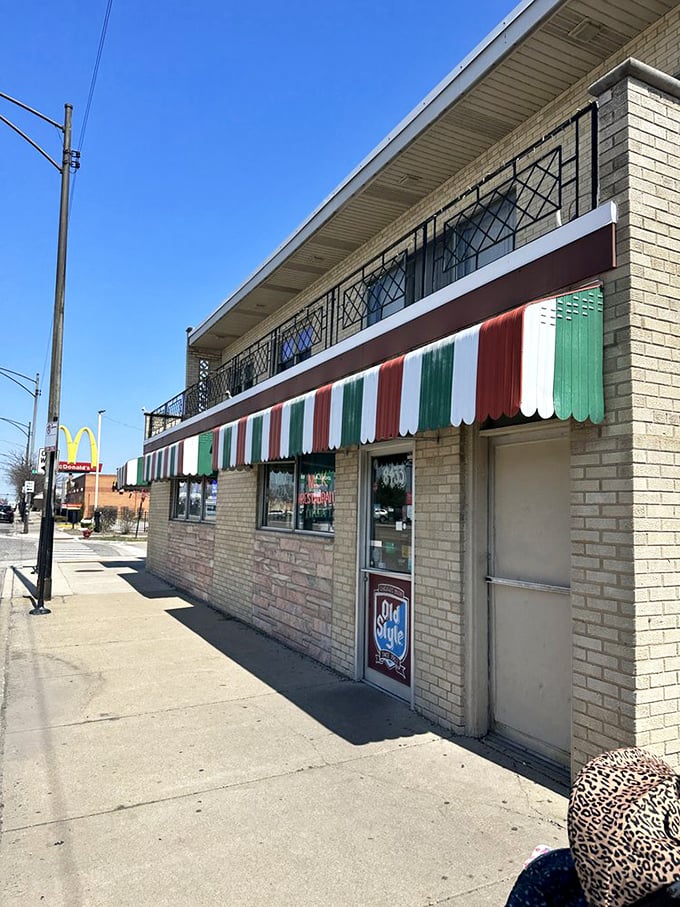 That iconic striped awning isn't just weather protection—it's a landmark that's guided hungry Chicagoans home for generations.
