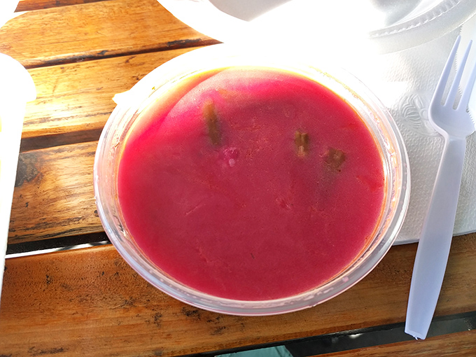 The vibrant crimson of homemade borscht practically sings from the container. This isn't just soup—it's liquid cultural heritage with a side of earthy sweetness.