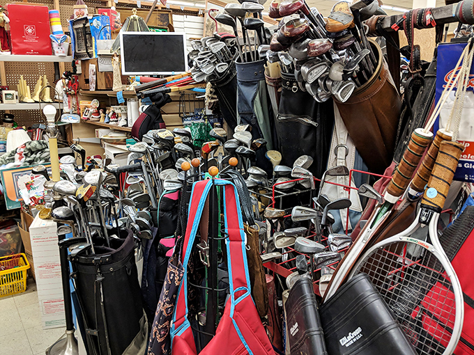 Golf club heaven! Even Tiger Woods would be impressed by this collection of putters, drivers, and woods waiting for their next round. 