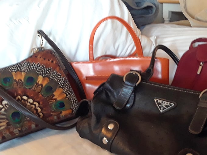 Designer handbags nestled together like old friends at a reunion – each with stories to tell and years of fashionable life still ahead.