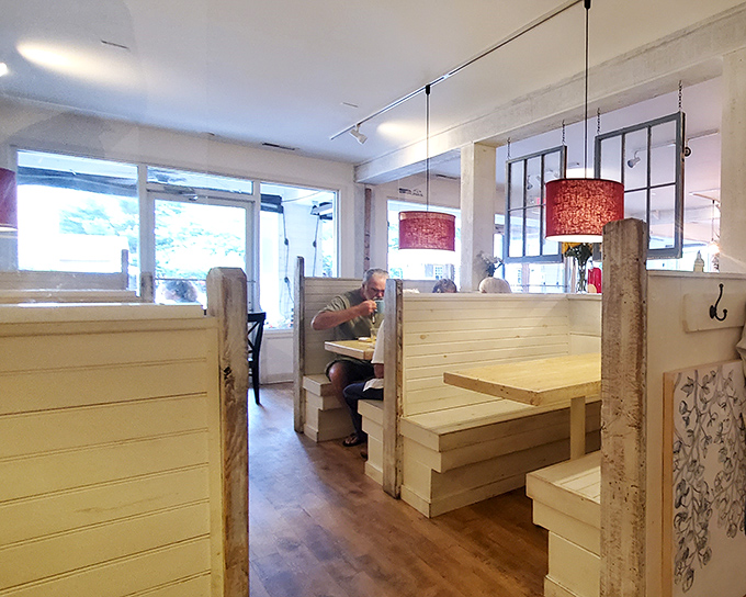 White booth dividers create intimate dining spaces while maintaining the airy, open feel that makes Egg so inviting.
