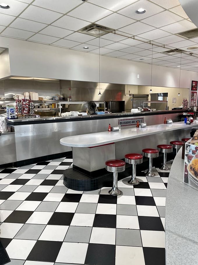 Counter culture at its finest—gleaming chrome, classic stools, and the promise of chili magic happening just behind that pass.