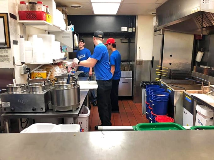 Behind the scenes, the kitchen crew orchestrates the symphony of sizzles and scents that has made Scooter's a legendary pit stop.