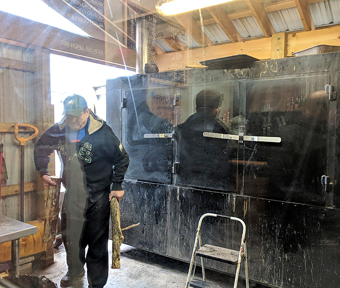Behind the scenes where the magic happens. The smoker—blackened by years of service—is the true heart of this operation.