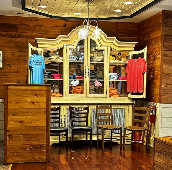 Even the merchandise corner embraces the rustic charm – t-shirts displayed in a repurposed hutch that your grandmother would approve of.