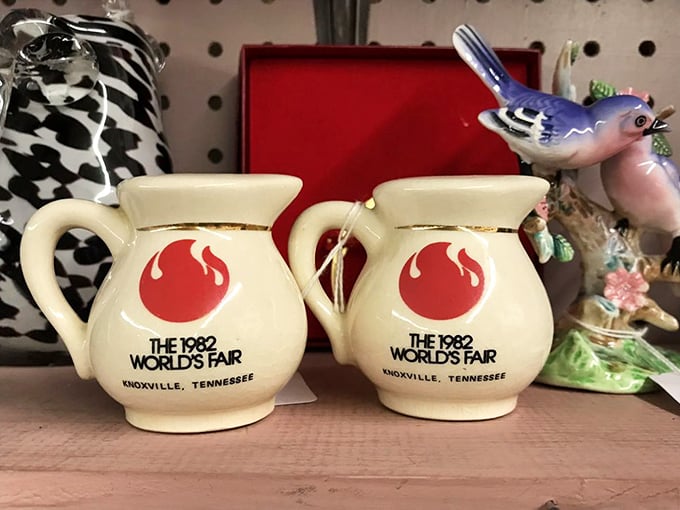 Knoxville World's Fair memorabilia—because nothing says "I was there in '82" like matching ceramic pitchers with flame logos.