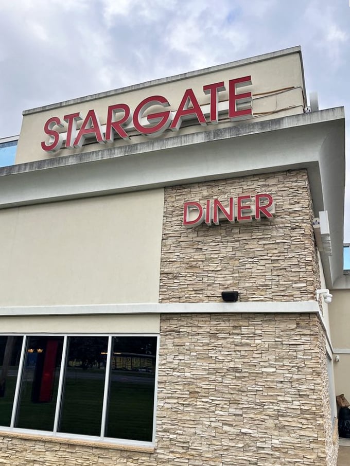 The stone facade and bold signage announce "STARGATE DINER" with confidence—no pretentious small fonts or minimalist design here.