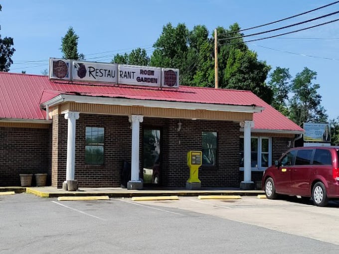 The red-roofed restaurant with white columns stands ready for another day of serving hungry travelers and locals—a humble temple of breakfast devotion.