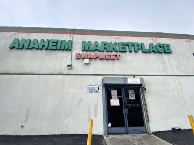 The other entrance to wonderland—where the sign promises "Swapmeet" but delivers an entire cultural expedition without the passport requirements.