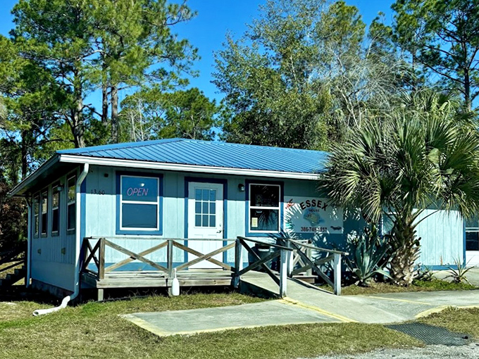 The blue exterior with its wooden porch ramp doesn't just say "we're open" – it whispers "come as you are" to seafood lovers everywhere.