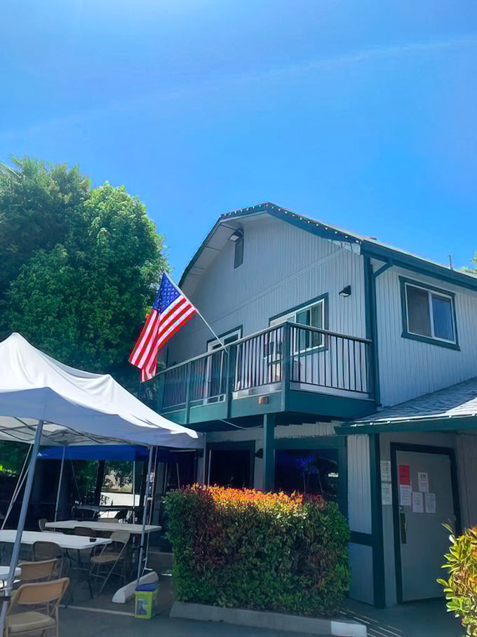 Outdoor seating under California blue skies, where the American flag waves as if to say, "This is how we do comfort food."