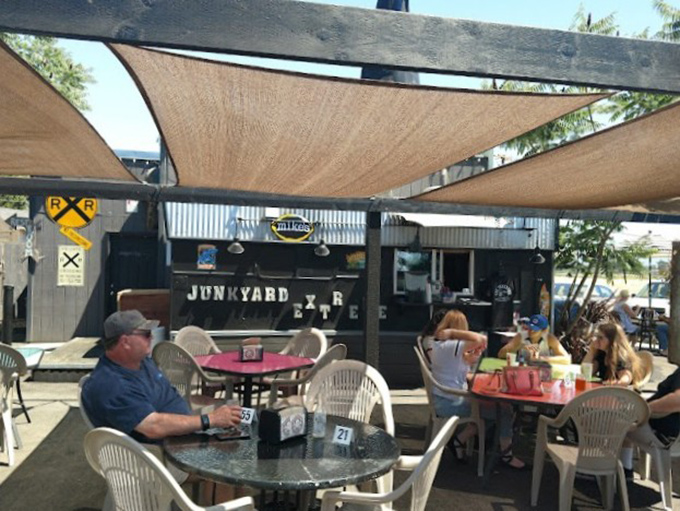 Outdoor dining under canvas sails—where Junction City sunshine meets culinary adventure in perfect harmony.
