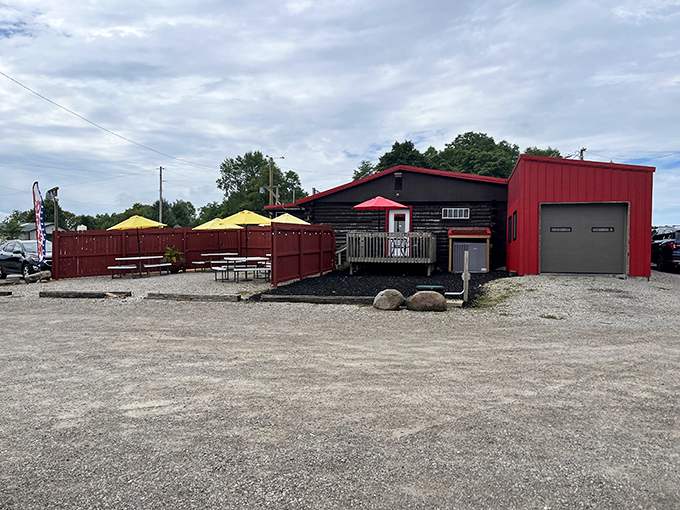 The outdoor seating area, where BBQ dreams come true under yellow umbrellas. Summer evenings were made for this exact scenario.