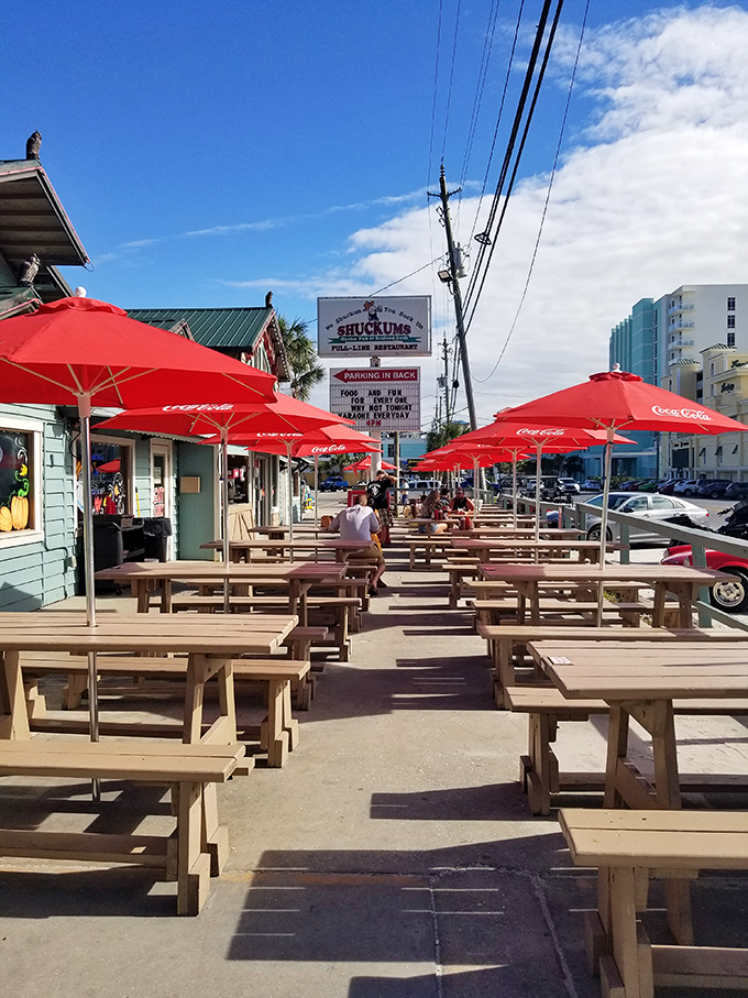 Picnic tables under Coca-Cola umbrellas—Florida's version of al fresco dining. The perfect spot to enjoy seafood while getting that vitamin D prescription filled.