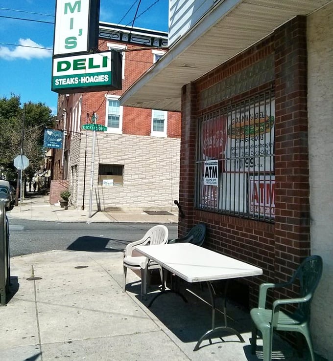 Al fresco dining, Philly-style. That plastic table has hosted more culinary joy than most five-star restaurants with their fancy tablecloths.