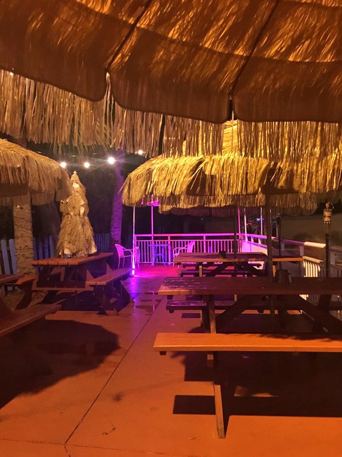 Tiki vibes and purple lighting transform outdoor dining into a tropical escape. Just add a cold drink and pretend you're on vacation.