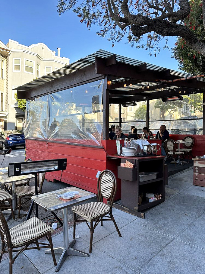 Outdoor dining with clear weather shields—because not even San Francisco fog should come between you and your moules frites.