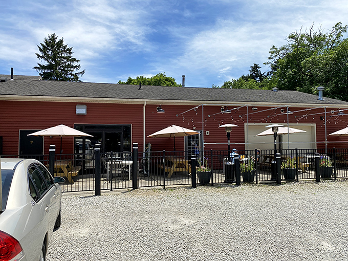 The outdoor patio beckons with umbrellas and fresh air—because sometimes great BBQ deserves blue skies and a gentle breeze as accompaniment.