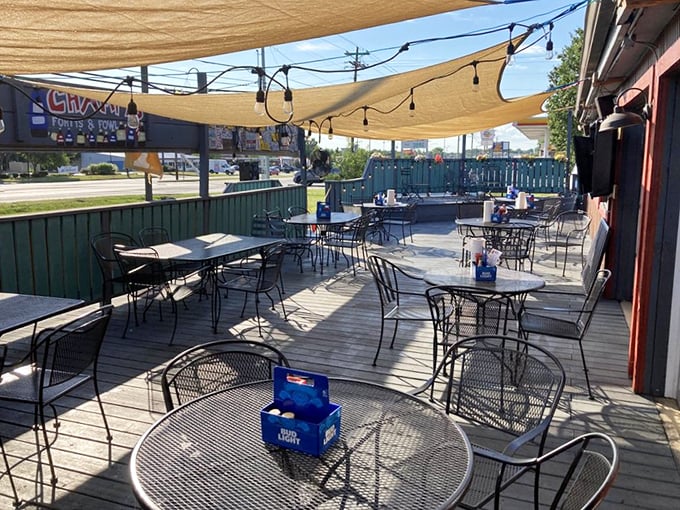 The outdoor patio—where summer evenings, cold beer, and hot chicken create memories that last longer than the meal itself.